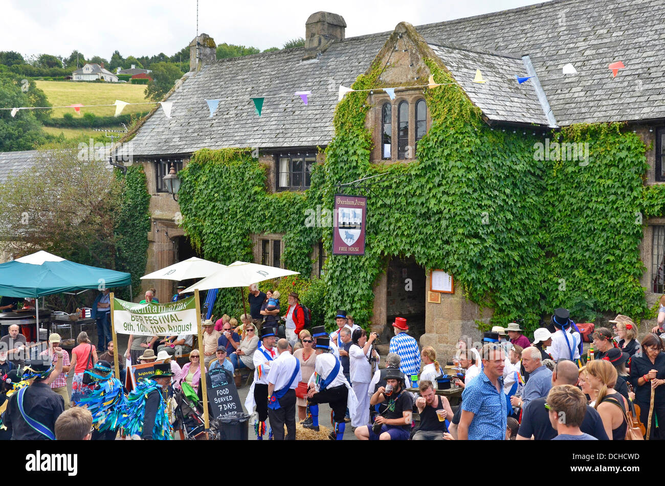 People outside The Oxenham Arms Pub, South Zeal, Dartmoor, Devon ...