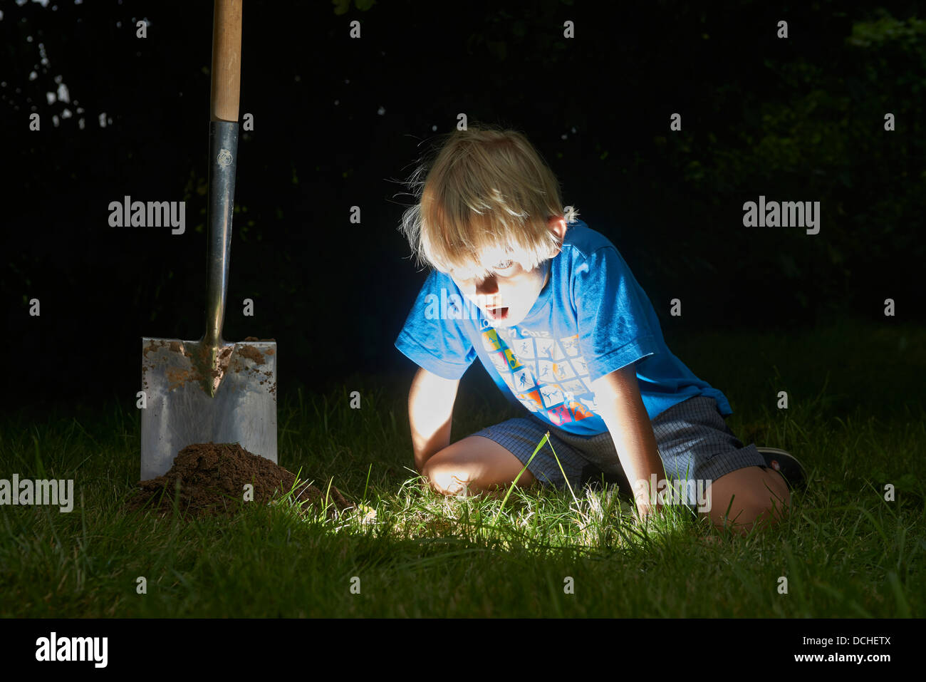 Digging a hole, boy hi-res stock photography and images - Alamy