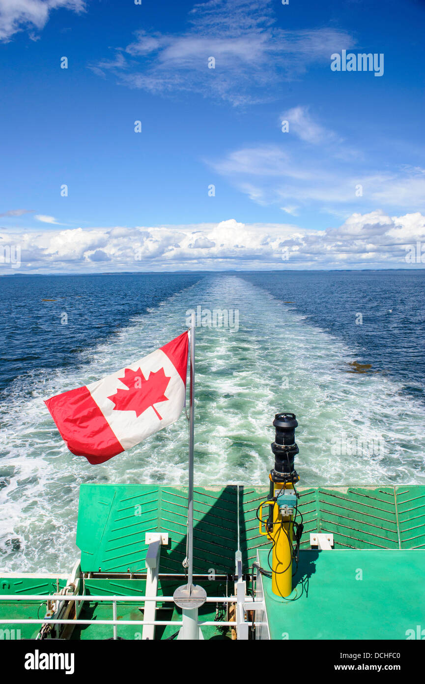 Canadian flag in the wake of the Grand Manan Ferry Stock Photo - Alamy