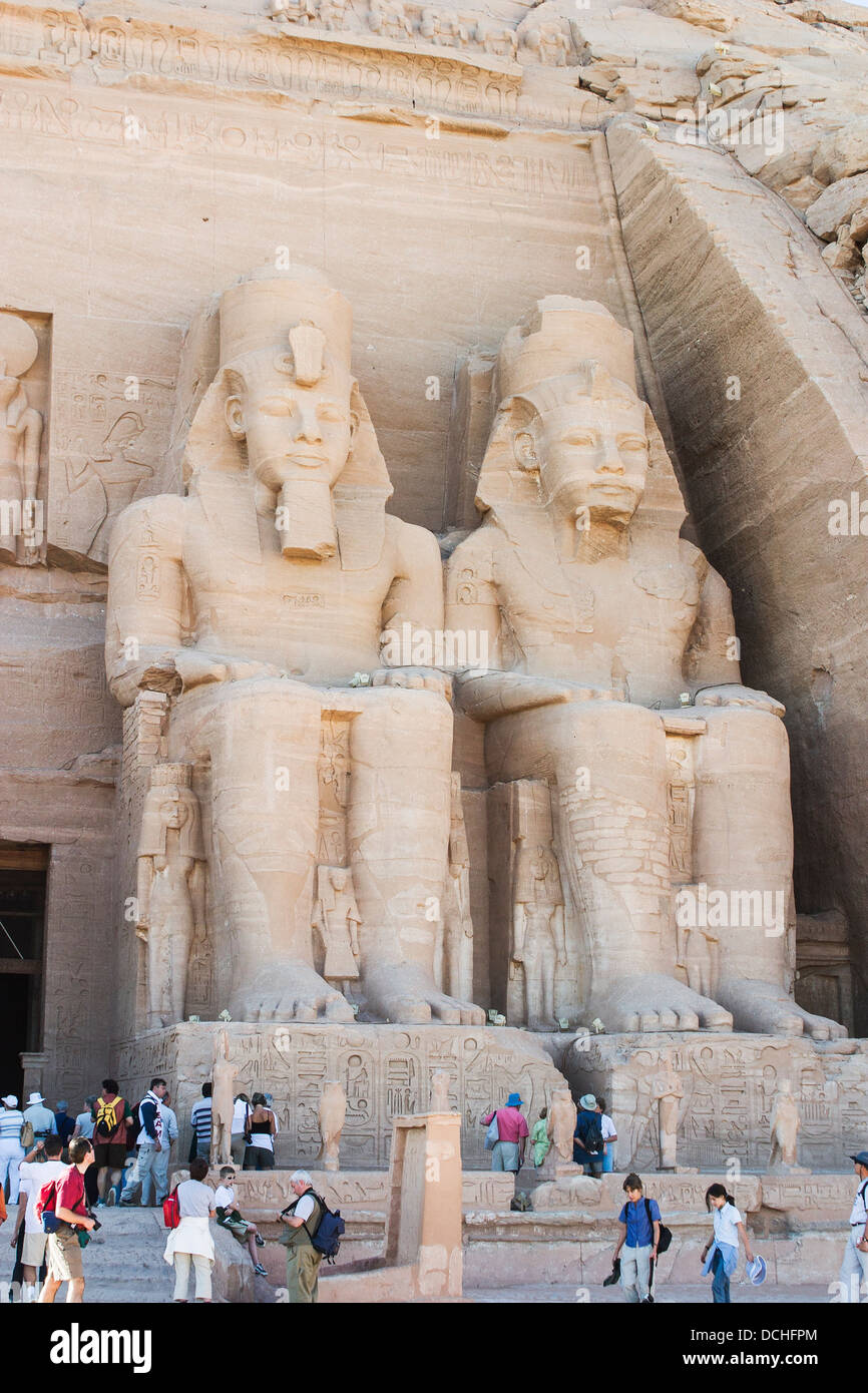 Two of the massive carved statues of Pharaoh Rameses II at Abu Simbel ...