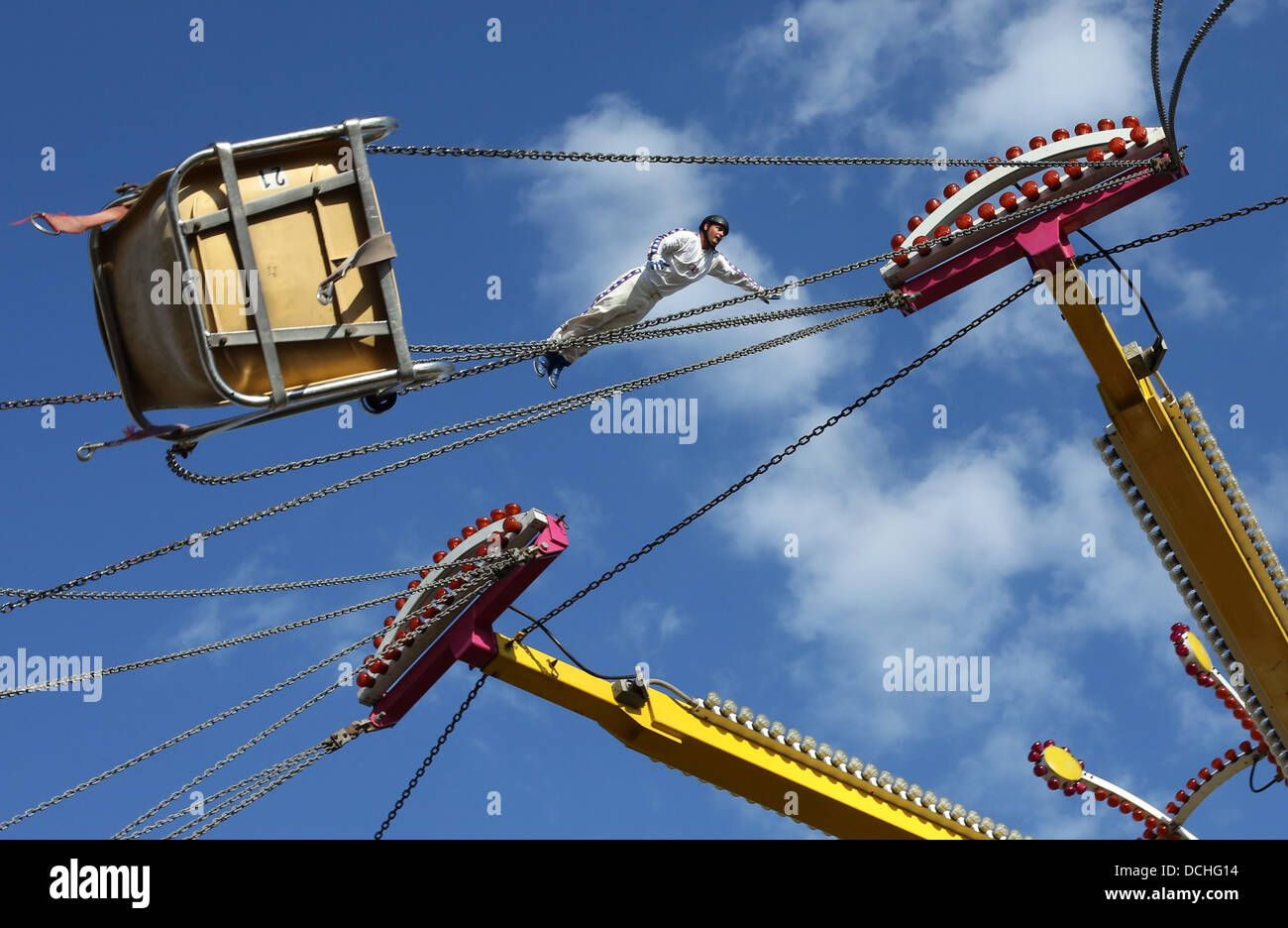 Human cannonball David Smith, Jr., shooting over a carnival ride at the ...