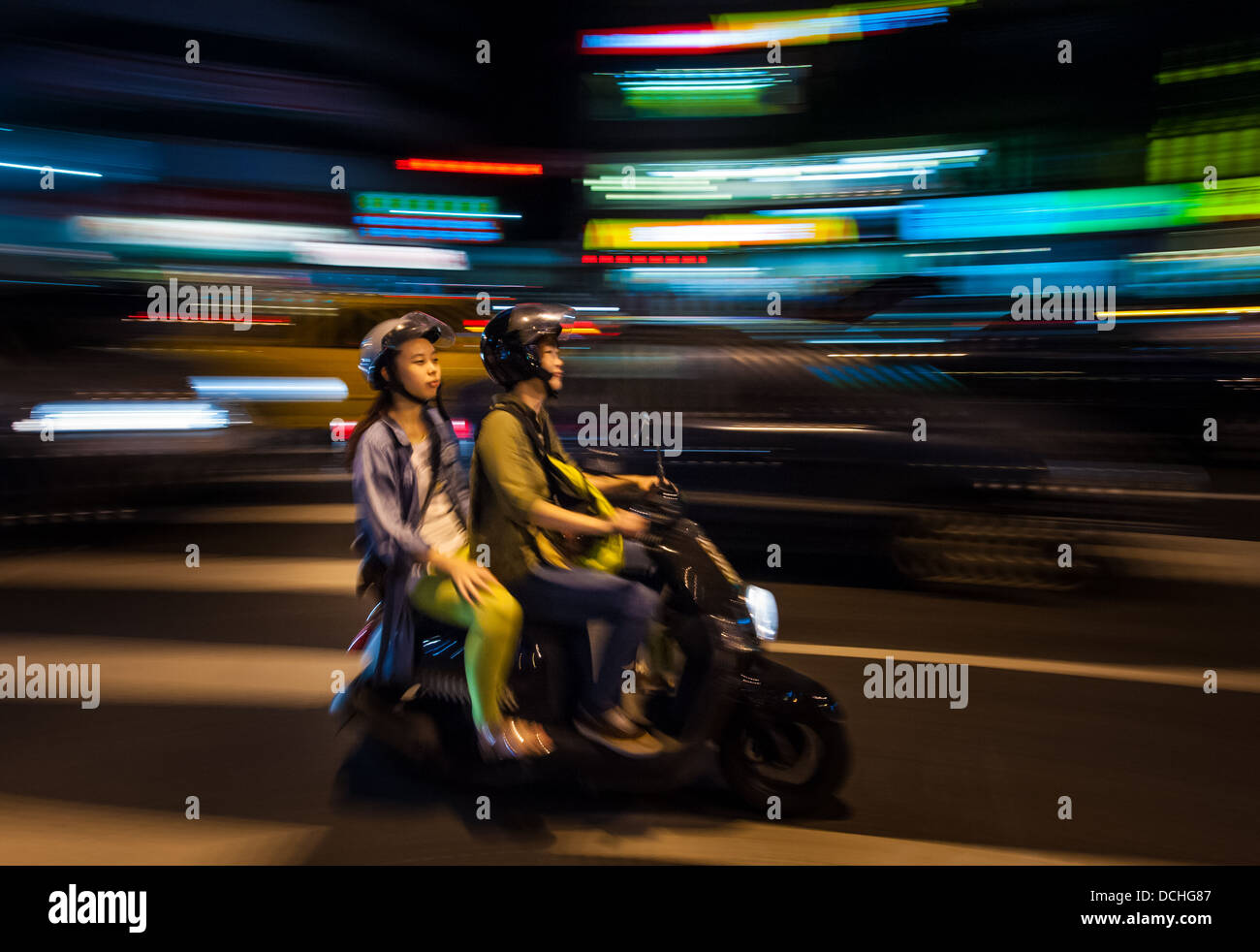 Motor scooters at night in central Taipei, Taiwan Stock Photo - Alamy