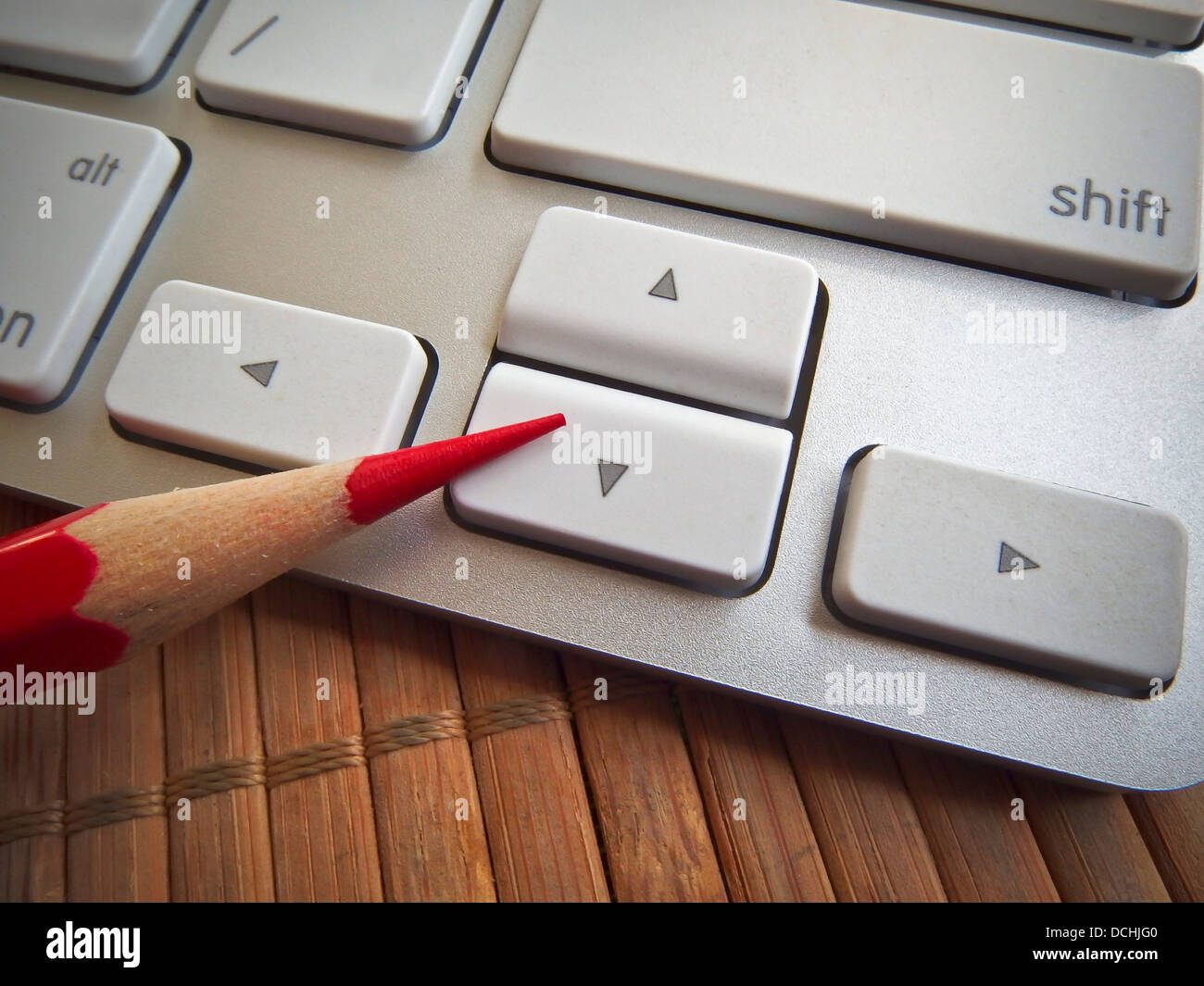 Pencil on keyboard buttons Stock Photo - Alamy
