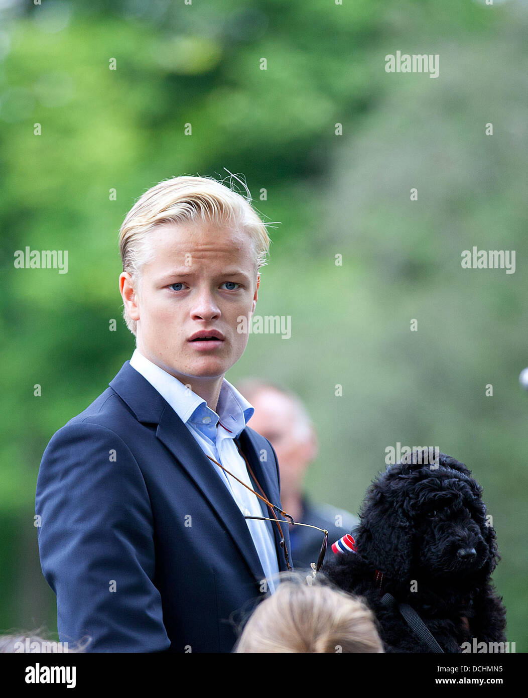 Oslo, Norway. 18th Aug, 2013. Marius Borg Hoiby arrives with one of the ...
