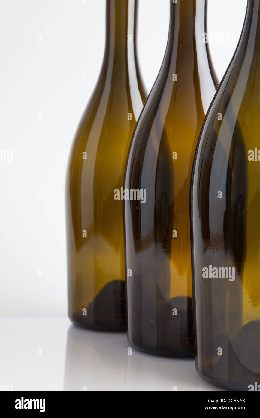 Three empty bottles of wine Stock Photo - Alamy