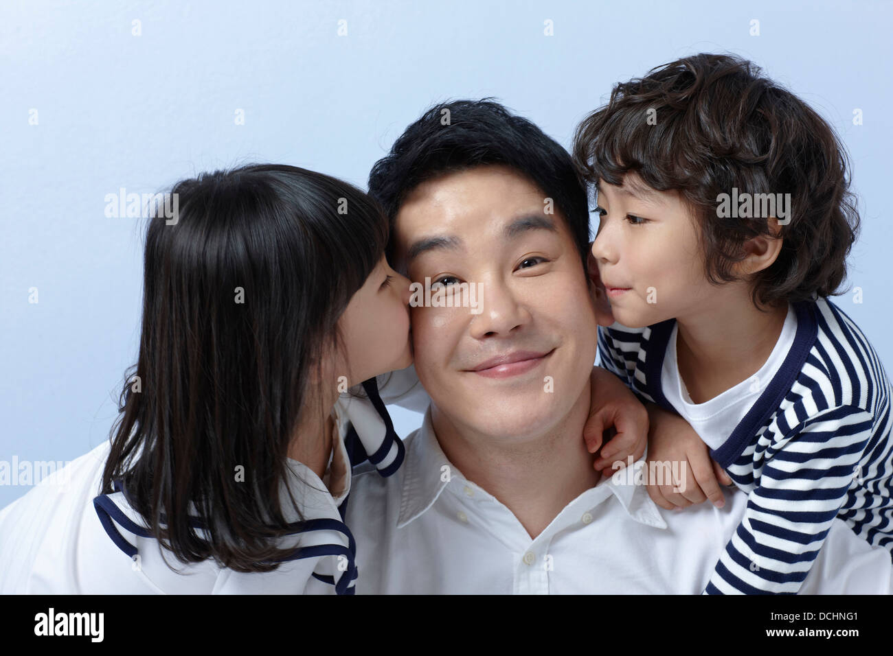 kids hugging their father Stock Photo - Alamy