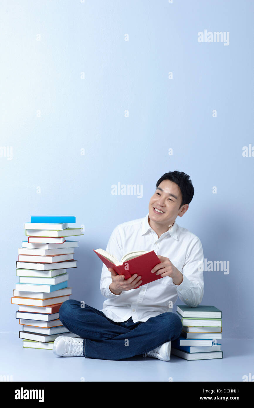 a man reading books Stock Photo - Alamy