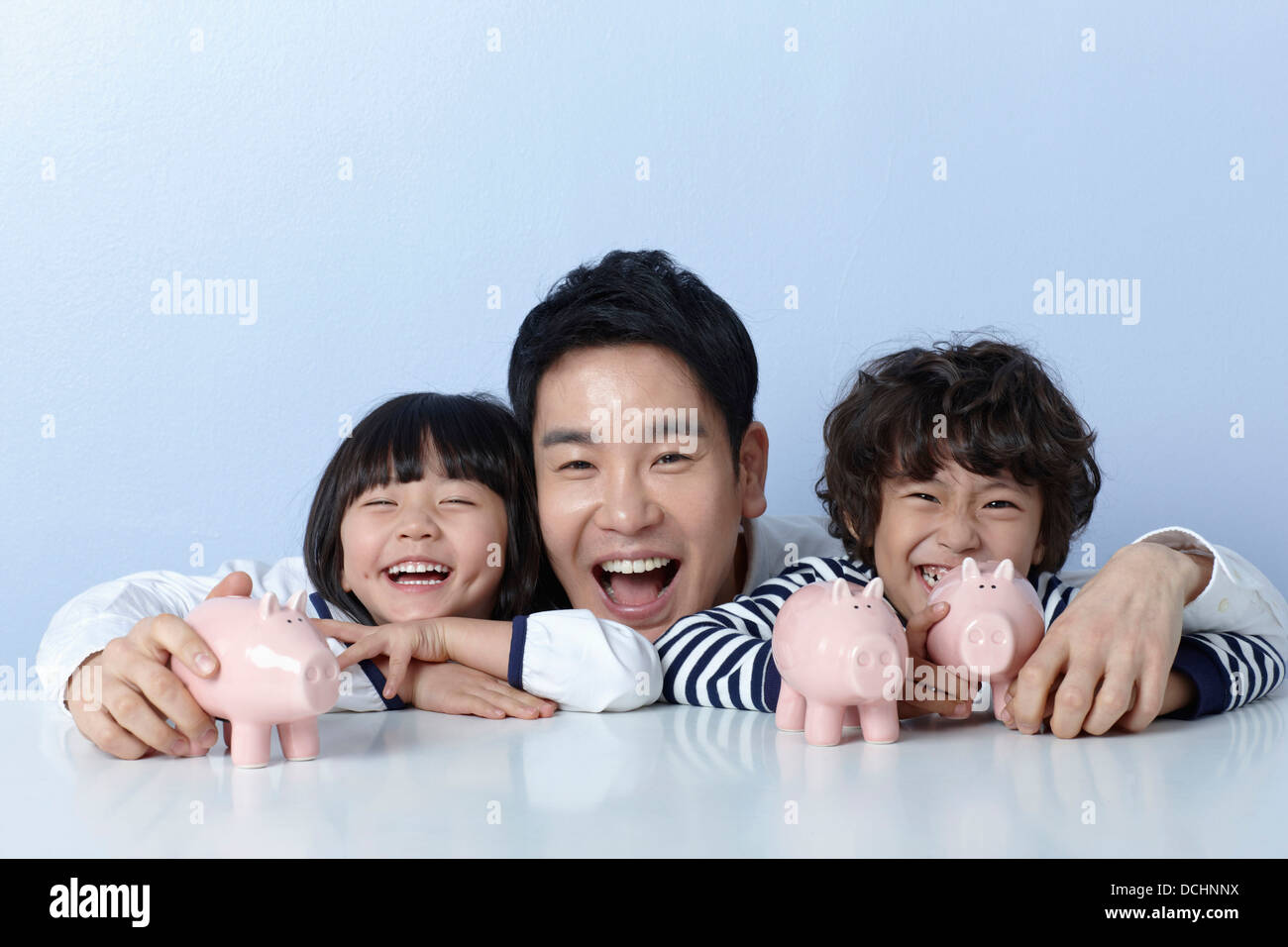 a father helping kids to save money Stock Photo - Alamy