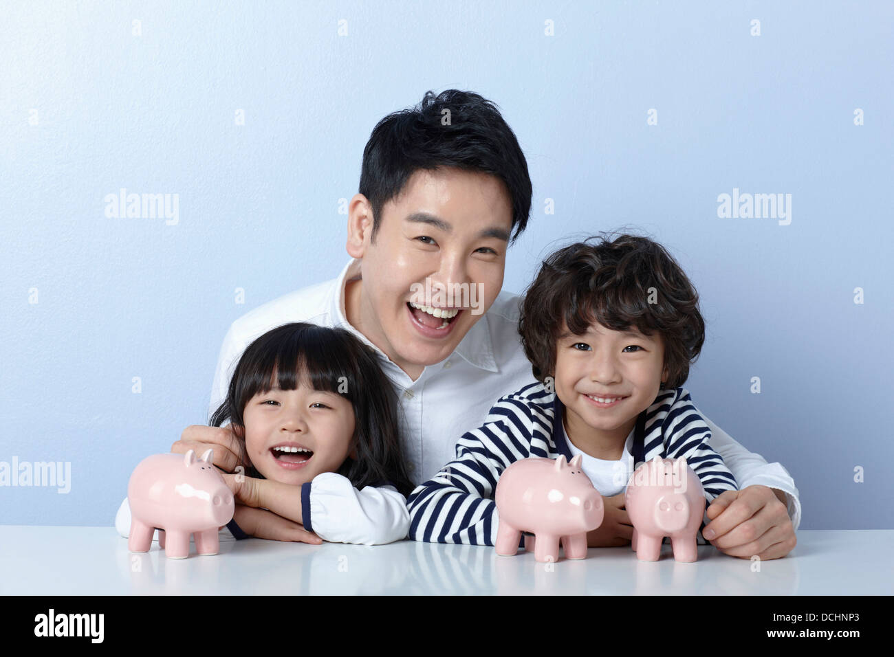 a father helping kids to save money Stock Photo - Alamy