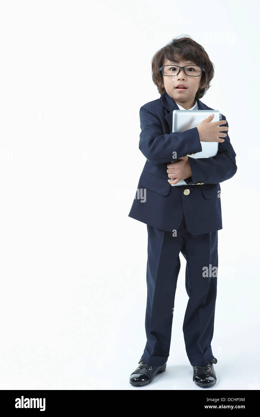 a boy dressed up as a business man Stock Photo - Alamy