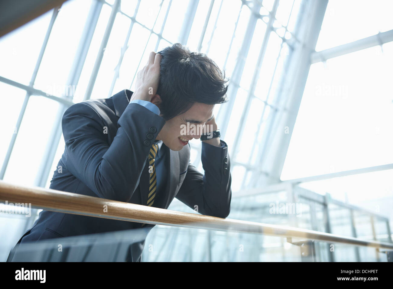 a business man scratching his head Stock Photo - Alamy