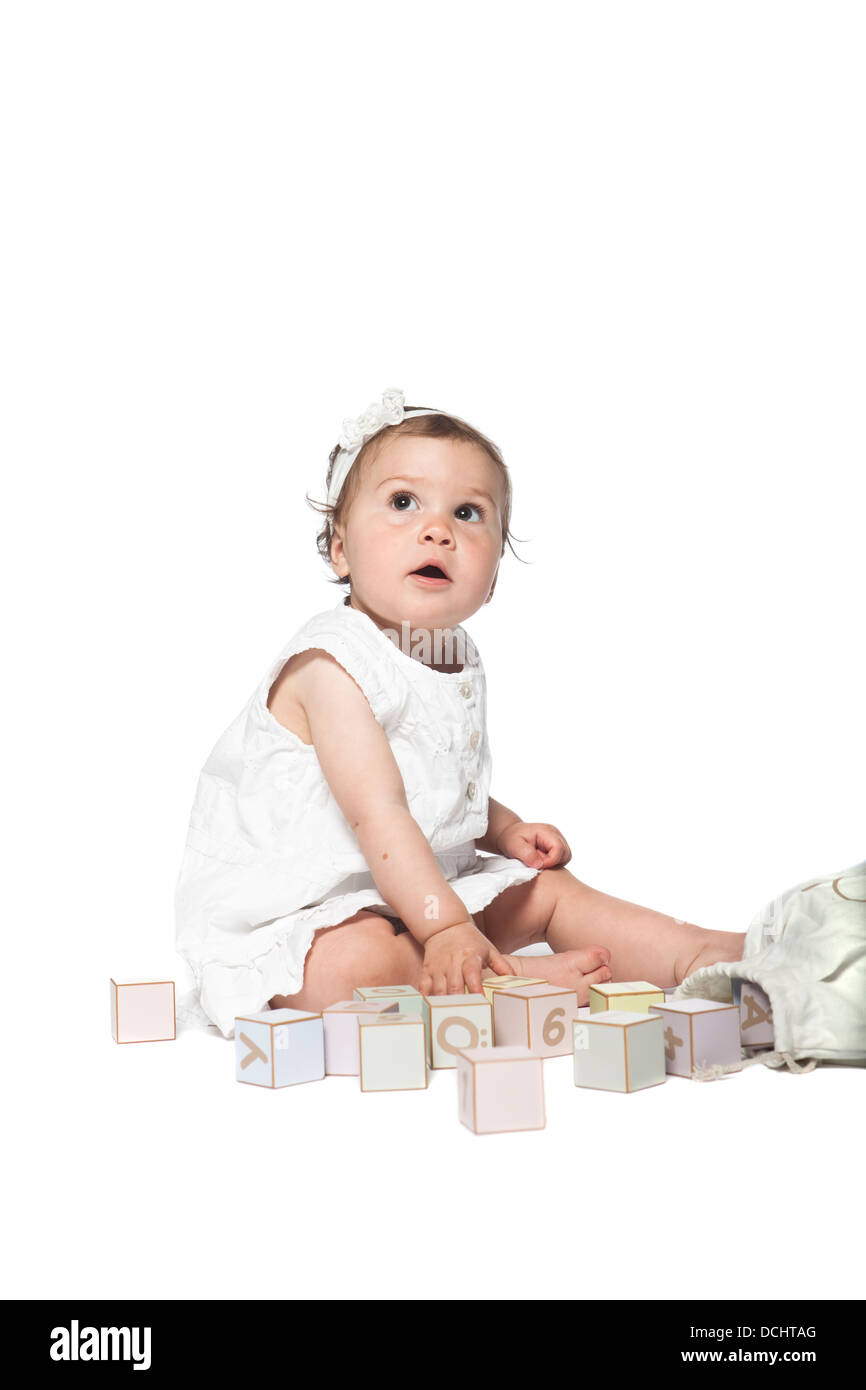 Girl playing with alphabet blocks Stock Photo - Alamy