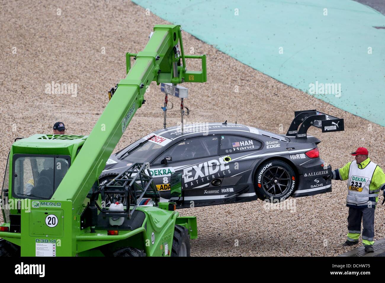 Nuerburg, Germany. 18th Aug, 2013. US BMW driver Joey Hand is recovered ...