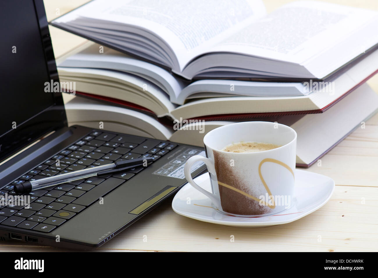 cup of coffee, books and laptop Stock Photo - Alamy
