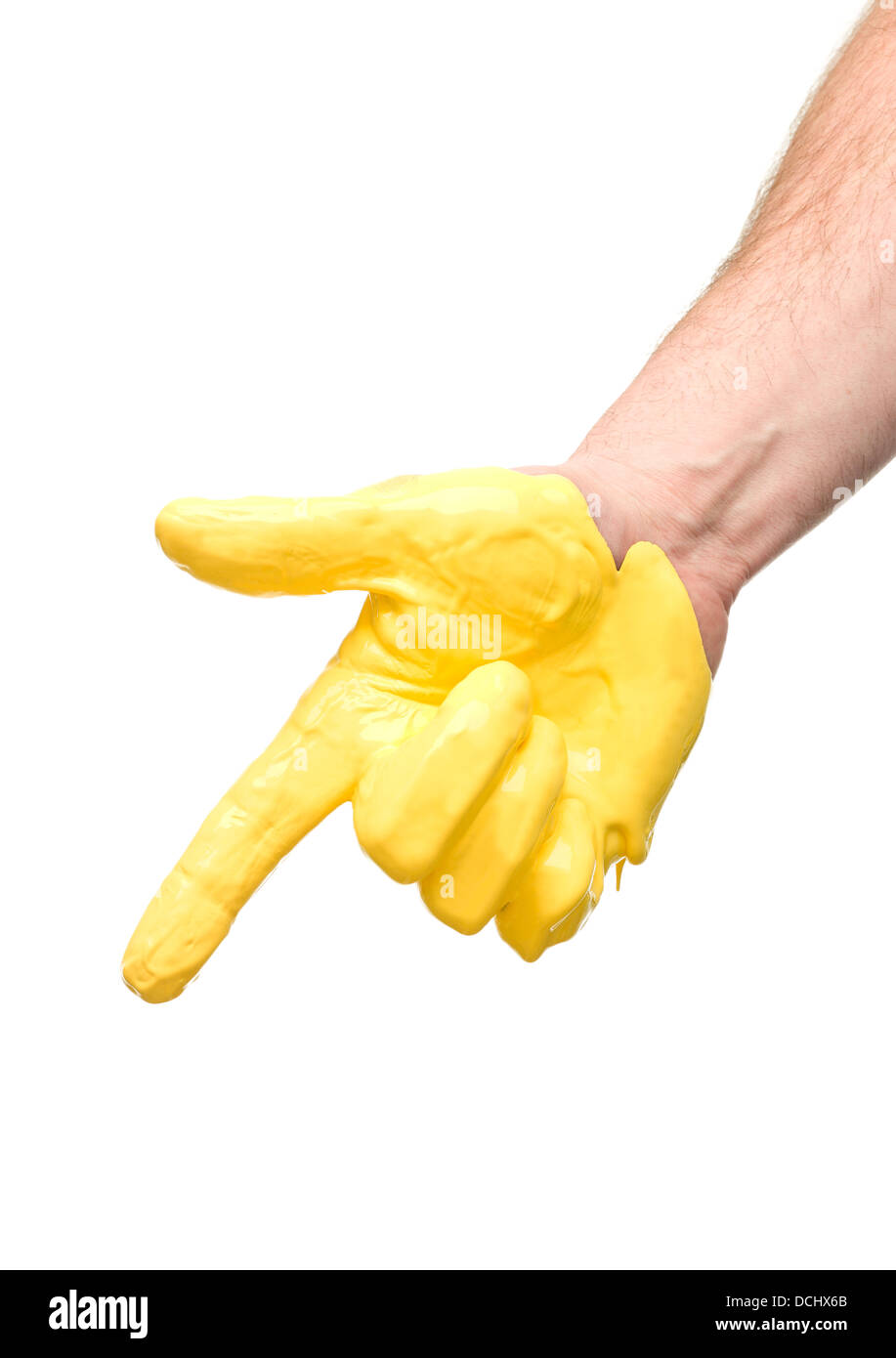 Yellow painted hand pointing Stock Photo - Alamy