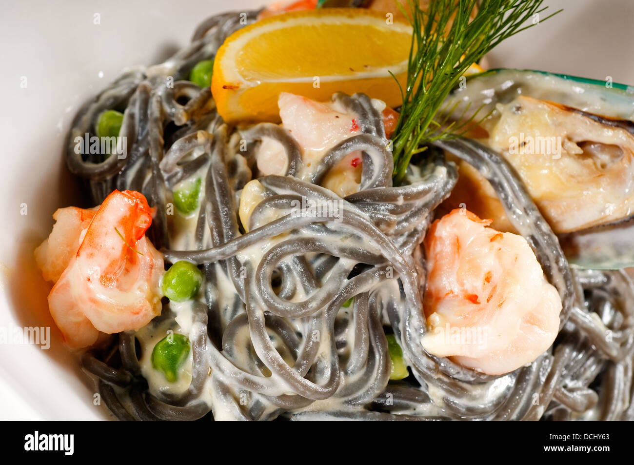 seafood black spaghetti Stock Photo - Alamy