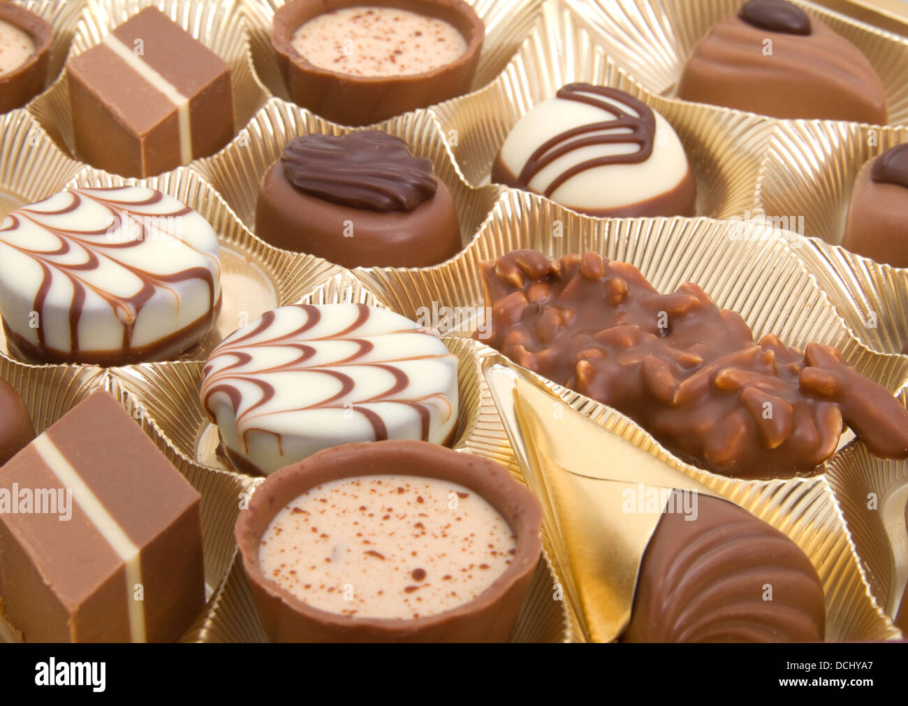 assortment chocolate pralines in a golden box Stock Photo - Alamy