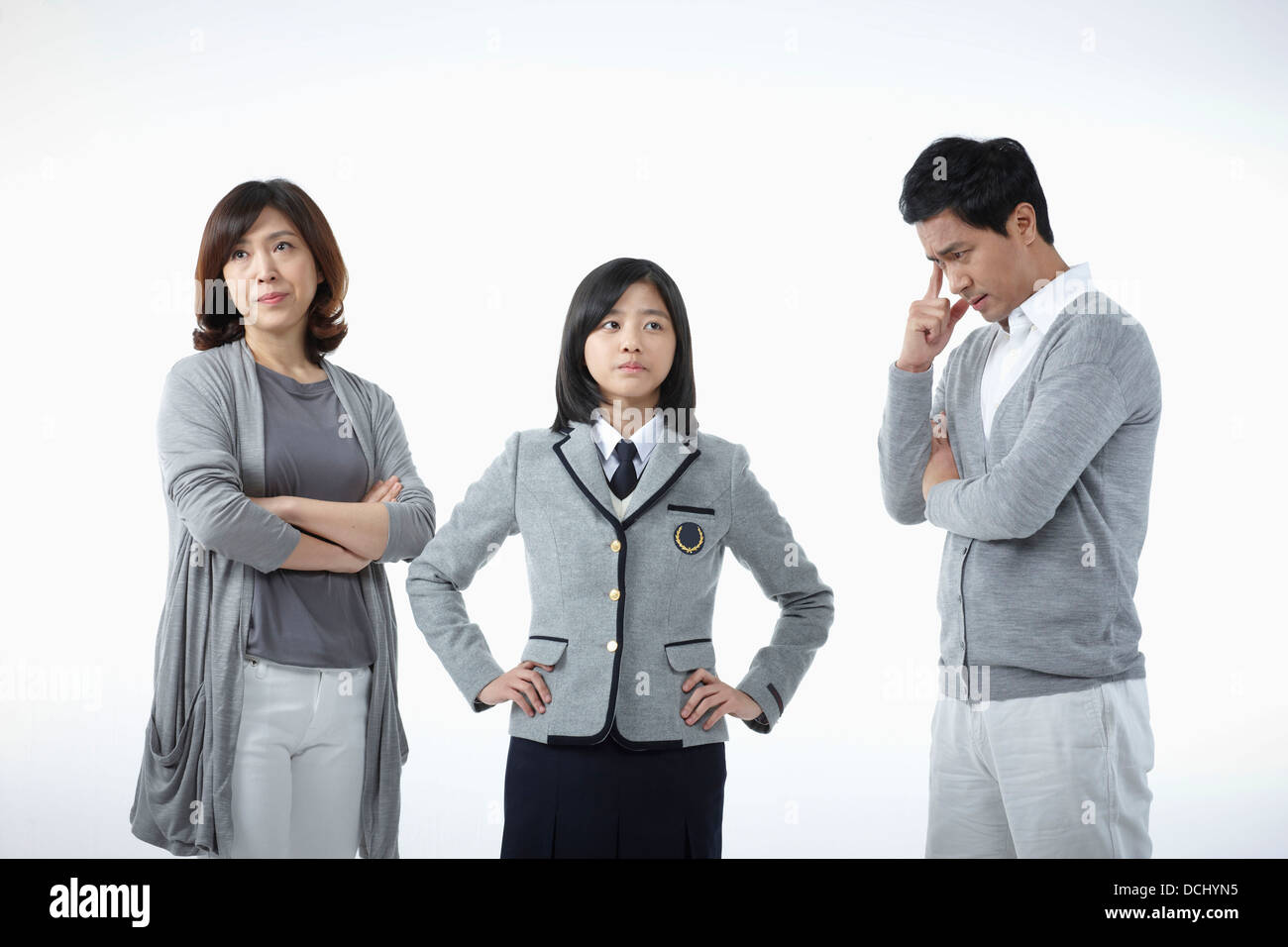 parents scolding at a daughter with a school uniform Stock Photo - Alamy