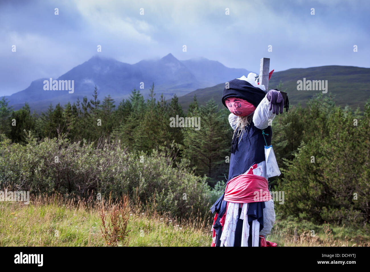 Storm clouds over the Cullins landscape; Scarecrow dressed in old ...