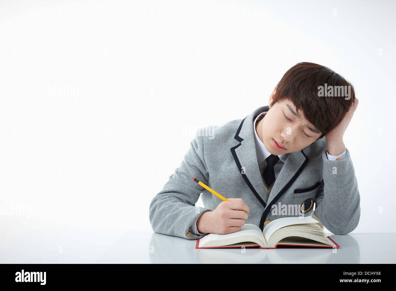 a boy doing homework Stock Photo - Alamy