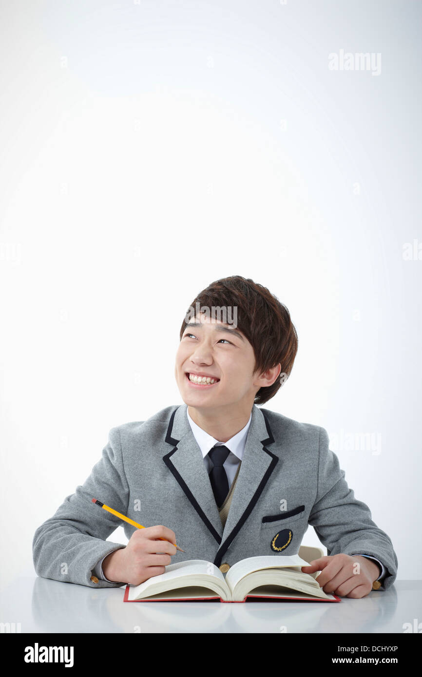 a boy doing homework Stock Photo - Alamy