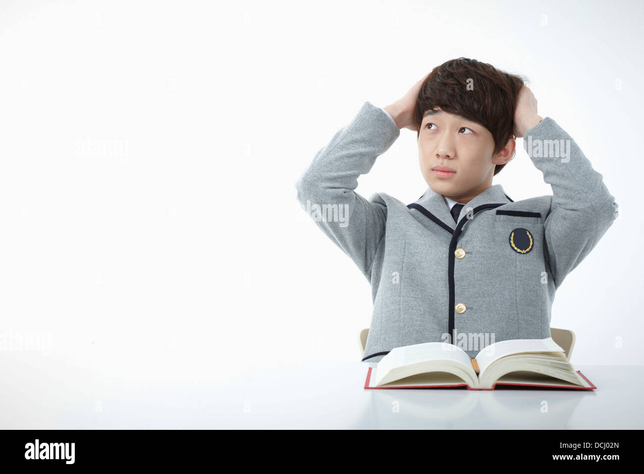 a boy doing homework Stock Photo - Alamy
