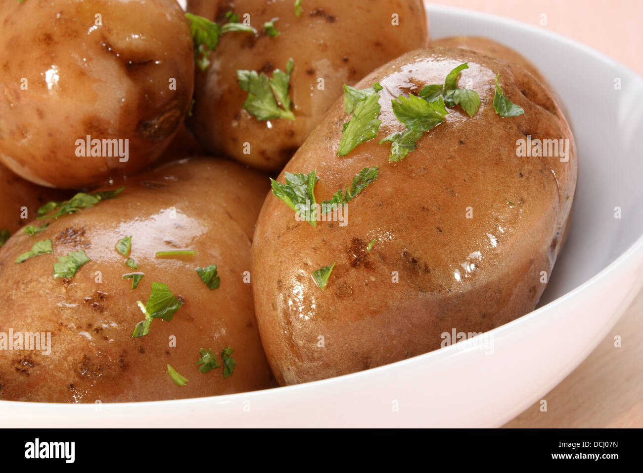 boiled potatoes with parsley in a white bowl Stock Photo - Alamy