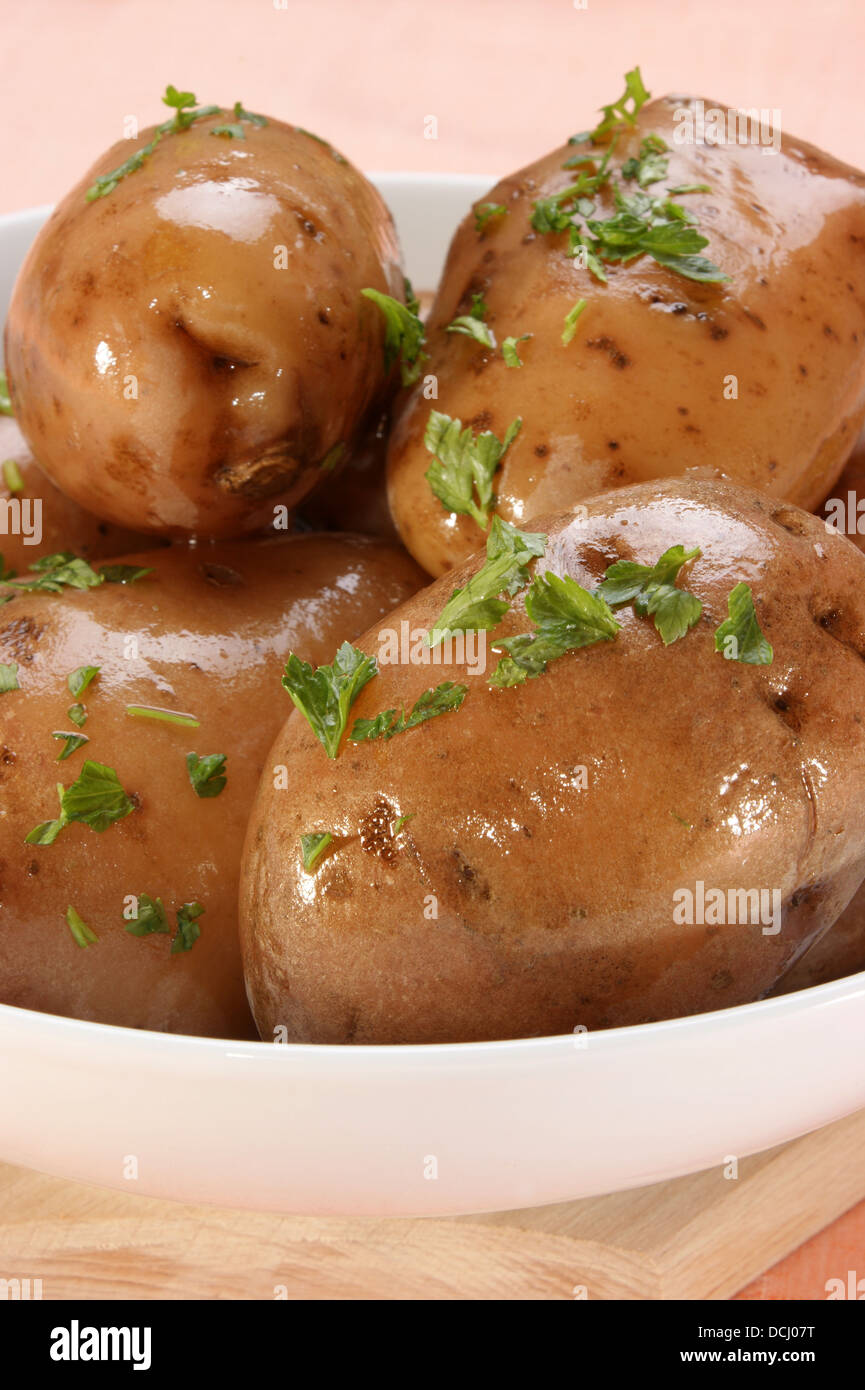 boiled potatoes with parsley in a white bowl Stock Photo - Alamy