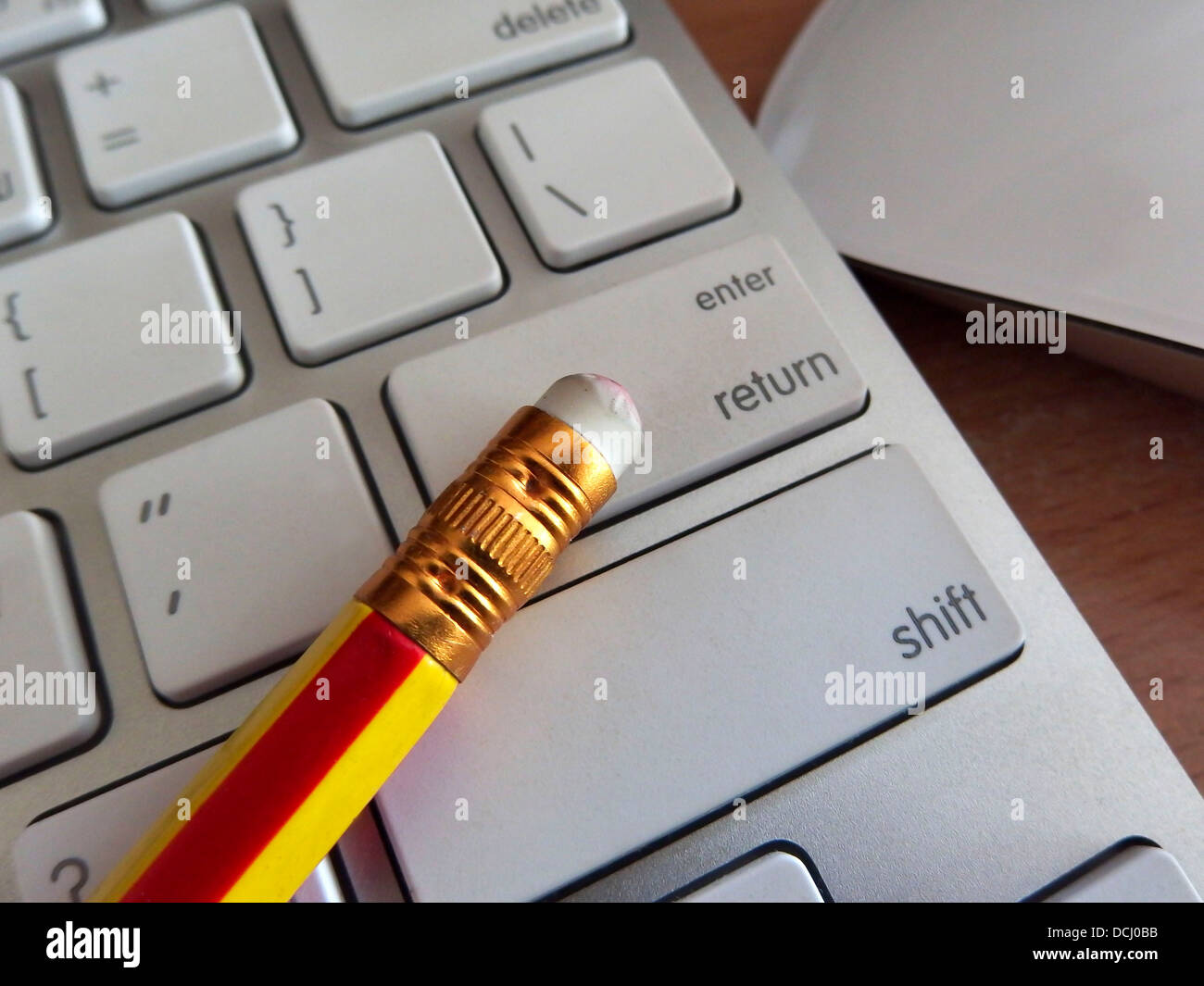 Pencil on keyboard buttons Stock Photo - Alamy