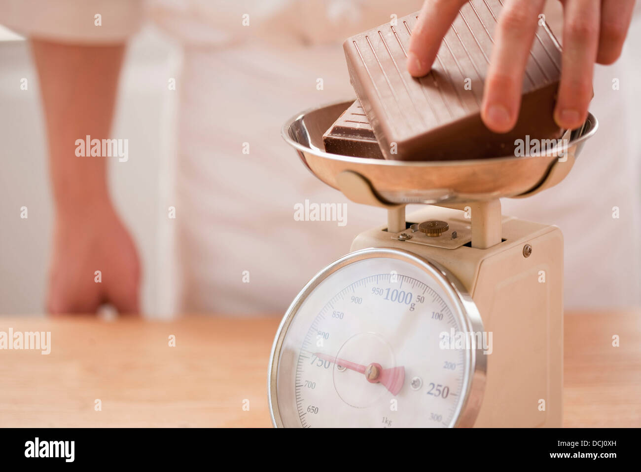 measuring the weigh of chocolate Stock Photo - Alamy