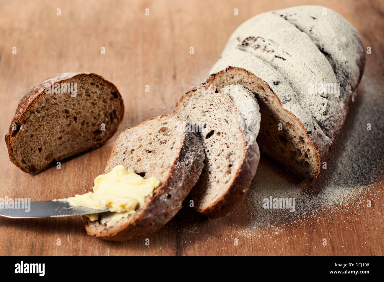 cut bread with butter on table Stock Photo - Alamy