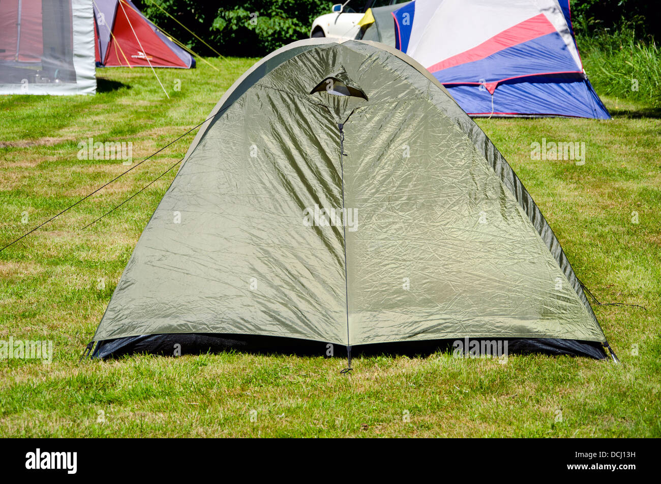 tent camping on summer time grass Stock Photo - Alamy