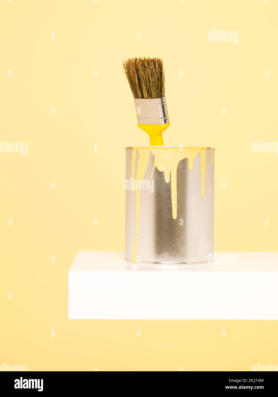 Yellow Paintcan and brush Stock Photo - Alamy