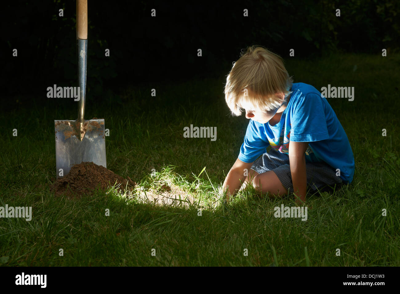 Child boy digging treasure in hi-res stock photography and images - Alamy