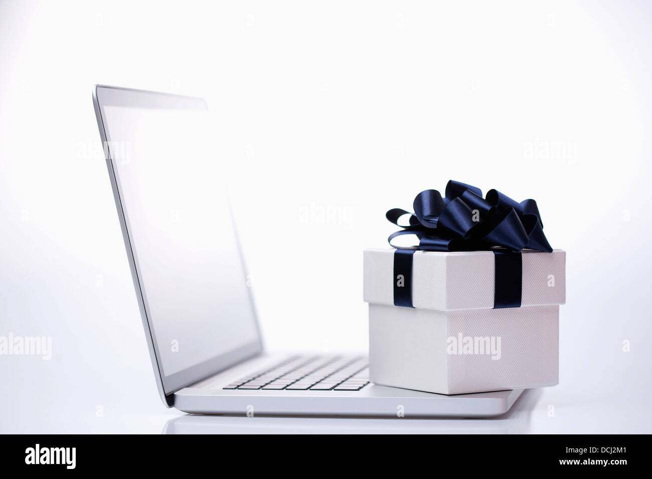 a gift box on a laptop Stock Photo - Alamy