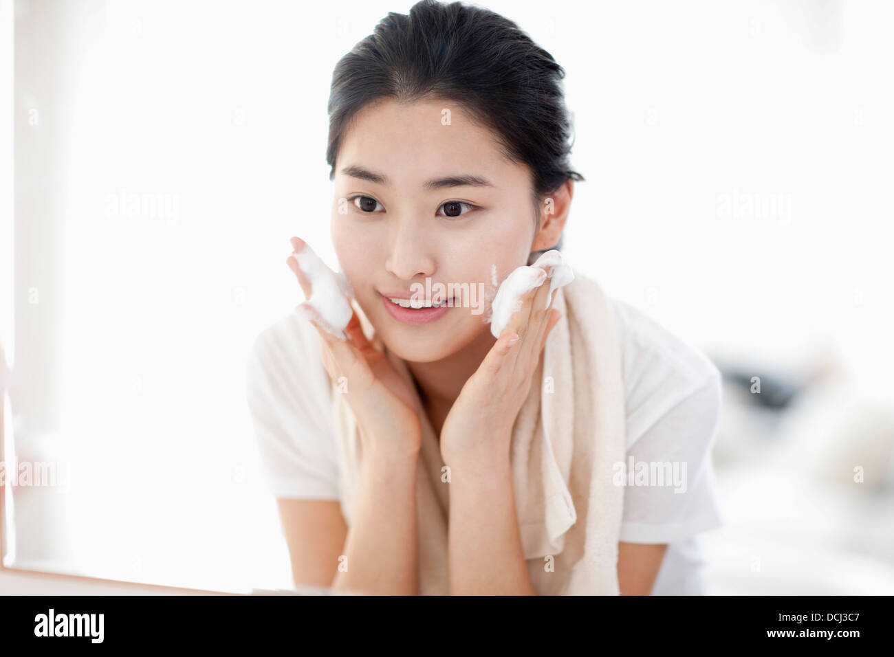 a woman washing her face Stock Photo - Alamy