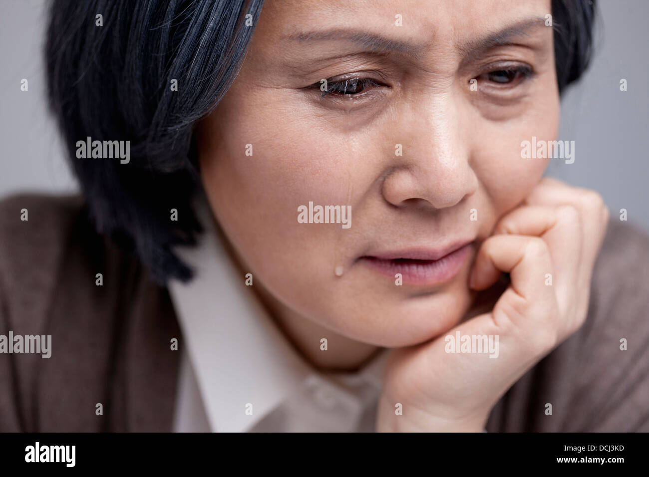 close up shot of middle aged woman crying Stock Photo - Alamy