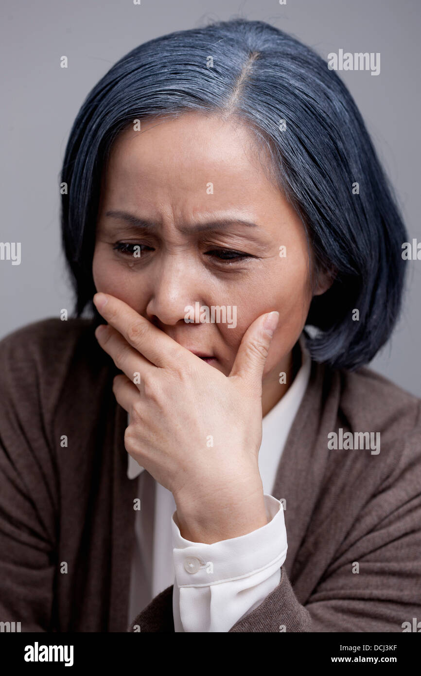 close up shot of middle aged woman crying Stock Photo - Alamy