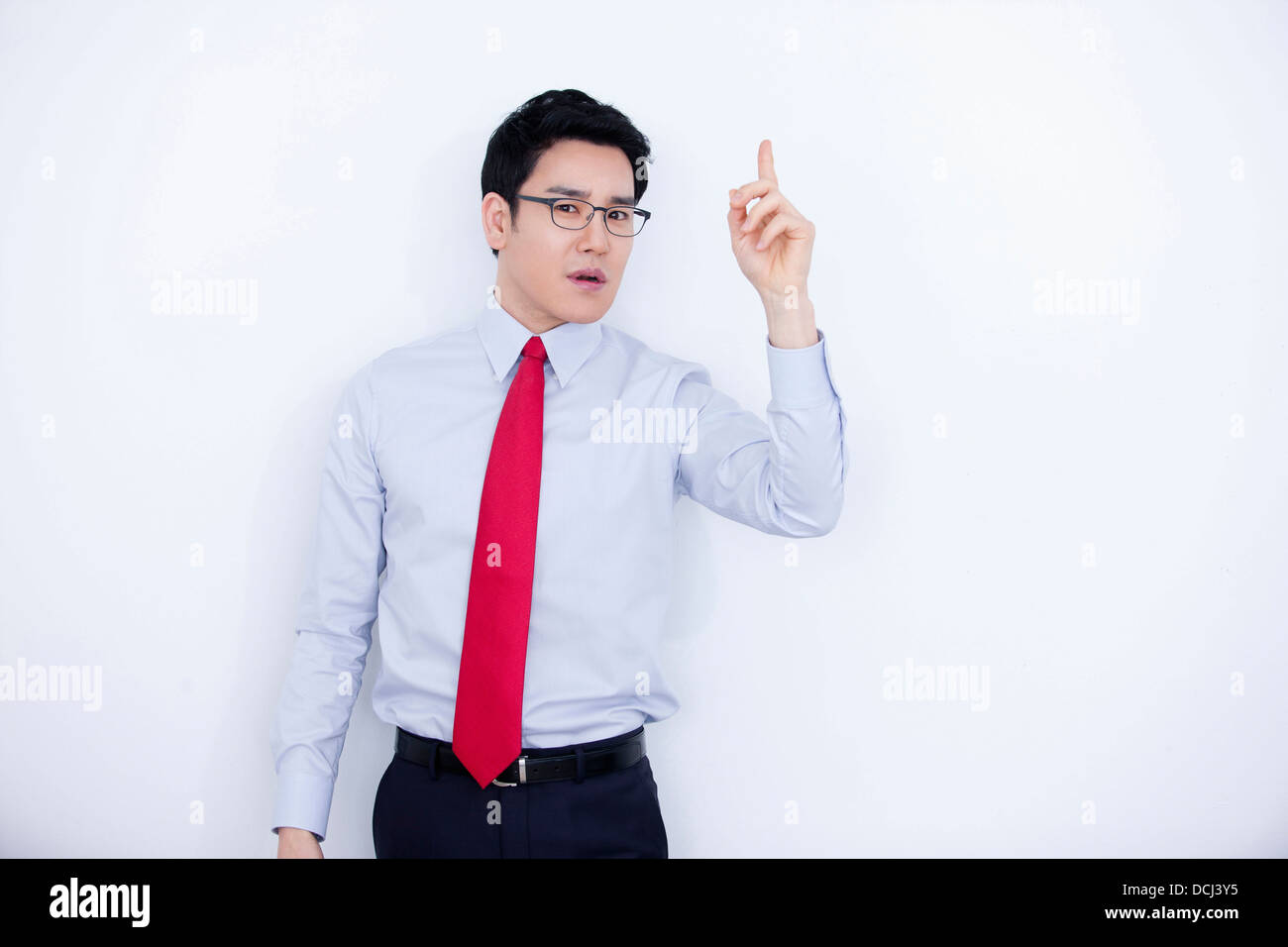 a businessman in business suit explaining using hand gesture Stock ...
