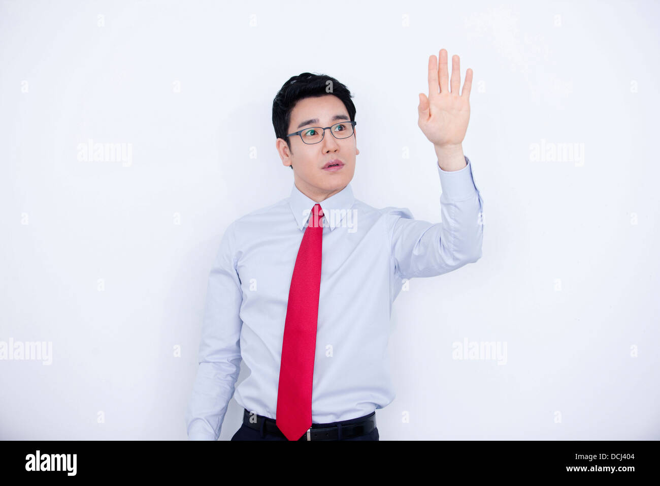 a businessman in business suit explaining using hand gesture Stock ...