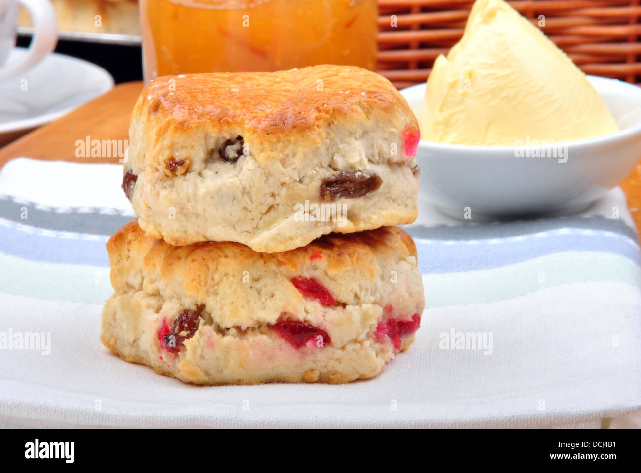 scone with organic jam on a timber board Stock Photo - Alamy
