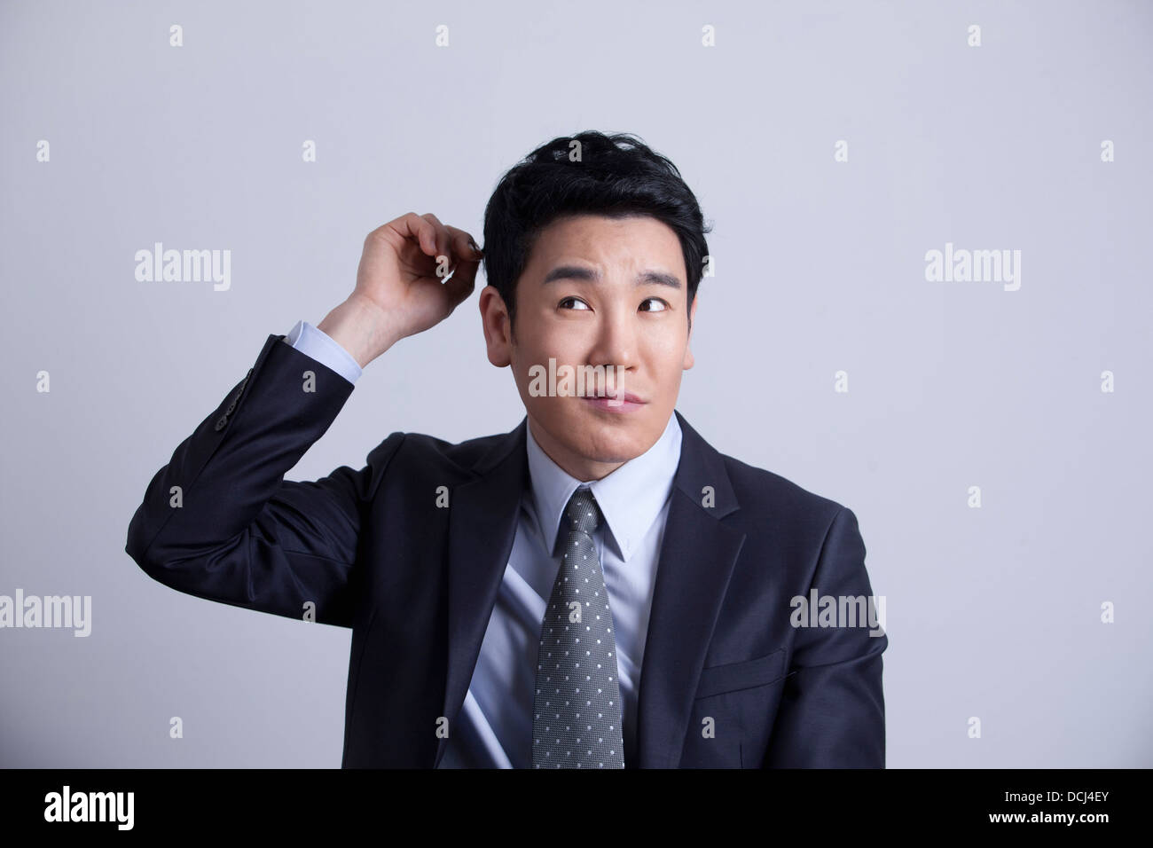a businessman looking confused Stock Photo - Alamy