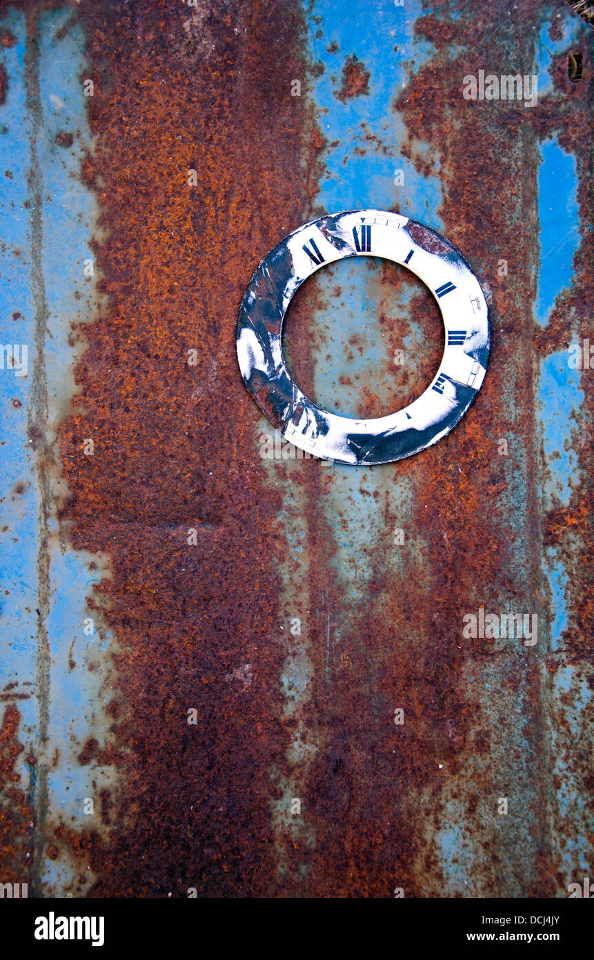 ancient clock face on rusty metal tin. Time concept Stock Photo - Alamy