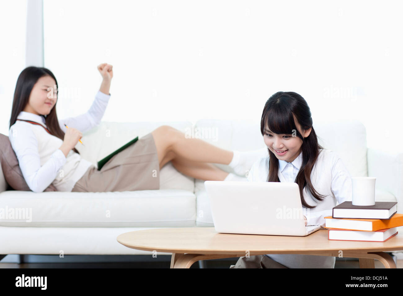 students in uniform studying together in a room Stock Photo - Alamy