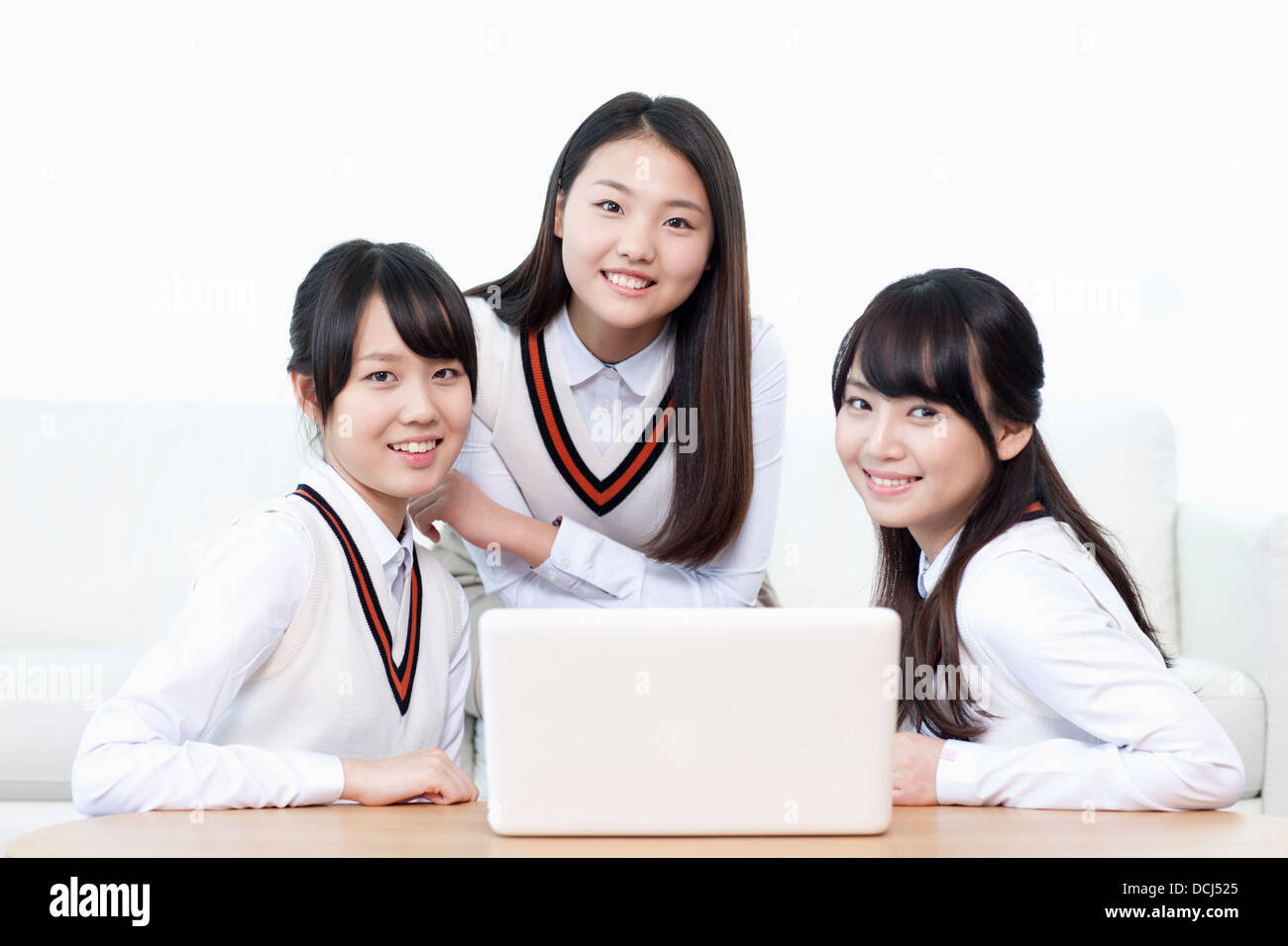 students in uniform studying together in a room Stock Photo - Alamy