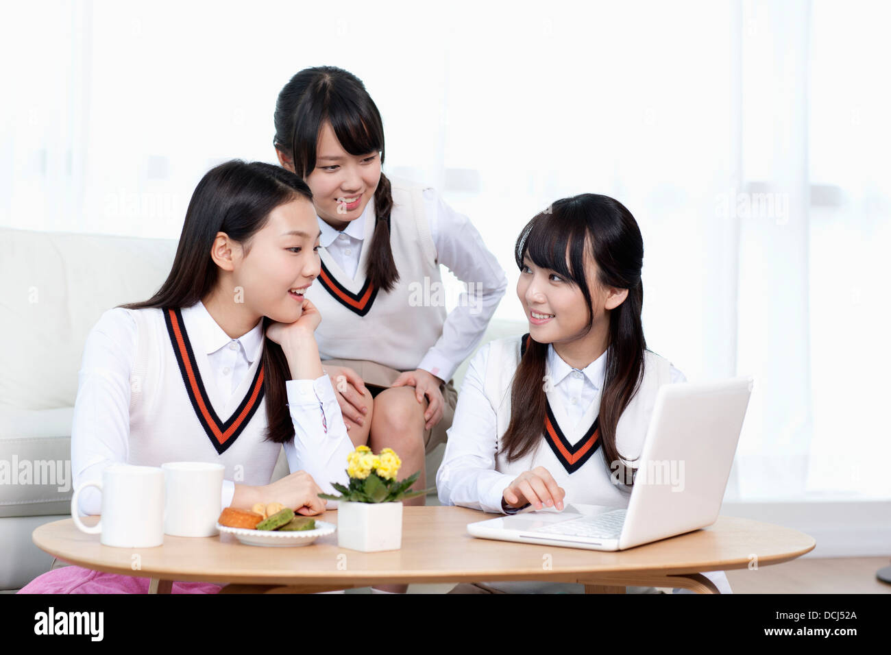 students in uniform studying together in a room Stock Photo - Alamy