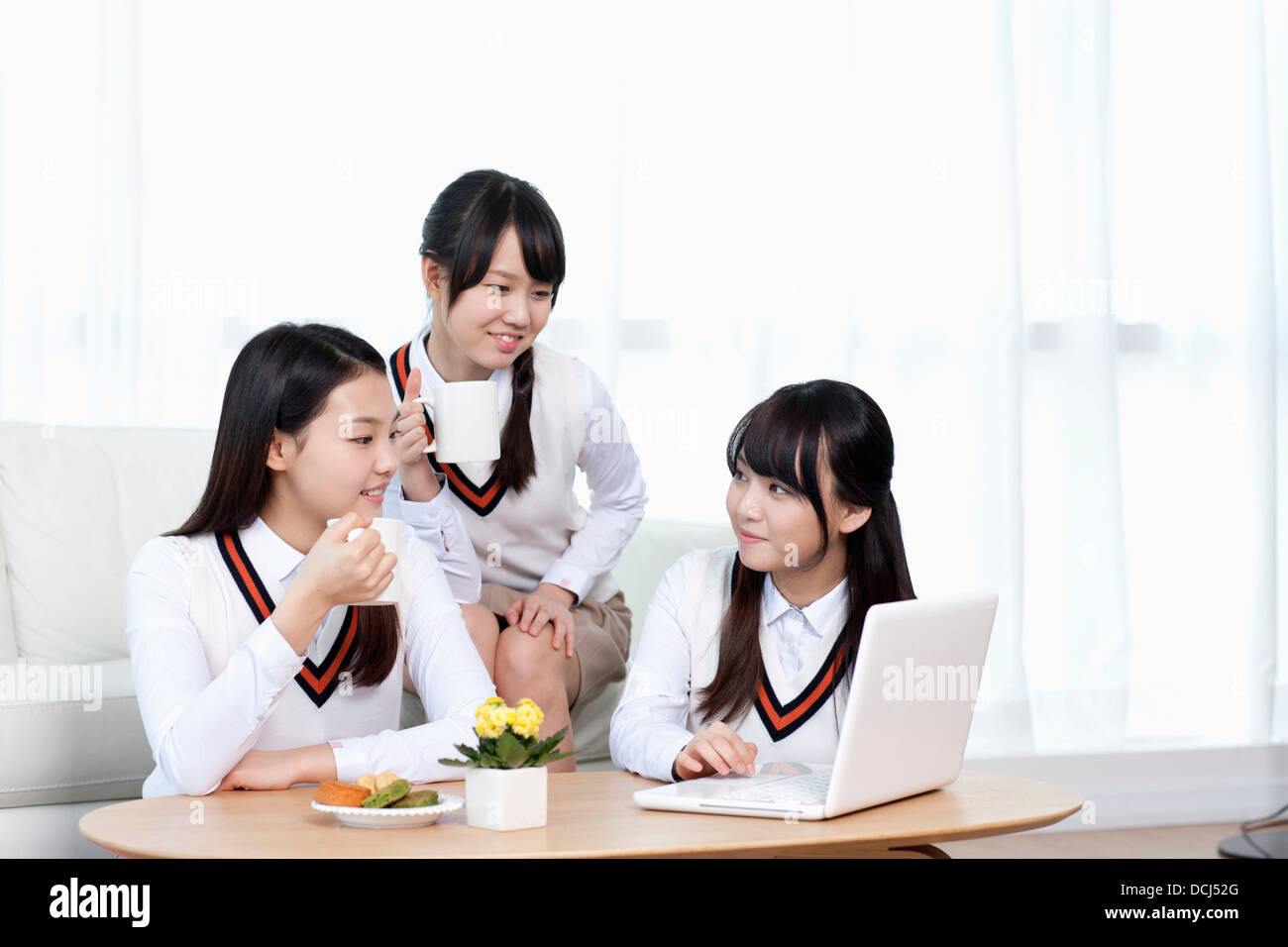 students in uniform studying together in a room Stock Photo - Alamy