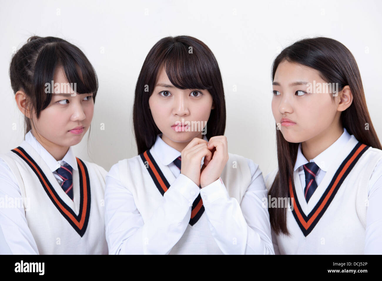 students in uniform staring at a friend Stock Photo - Alamy