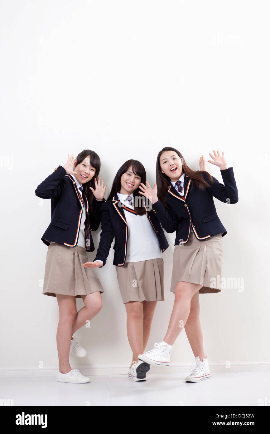students in uniform posing happily Stock Photo - Alamy