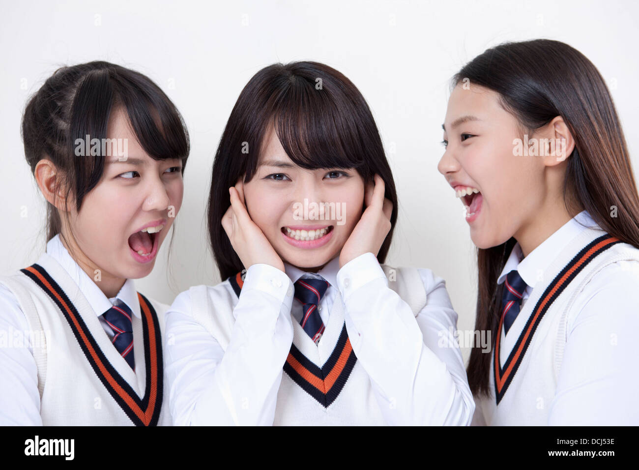 students in uniform shouting at a friend Stock Photo - Alamy